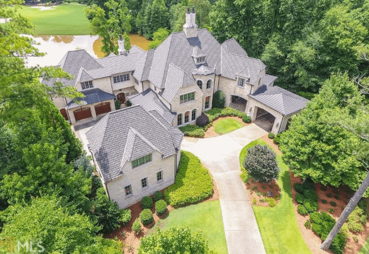 Lakefront Limestone Home In Suwanee, Georgia - Homes of the Rich