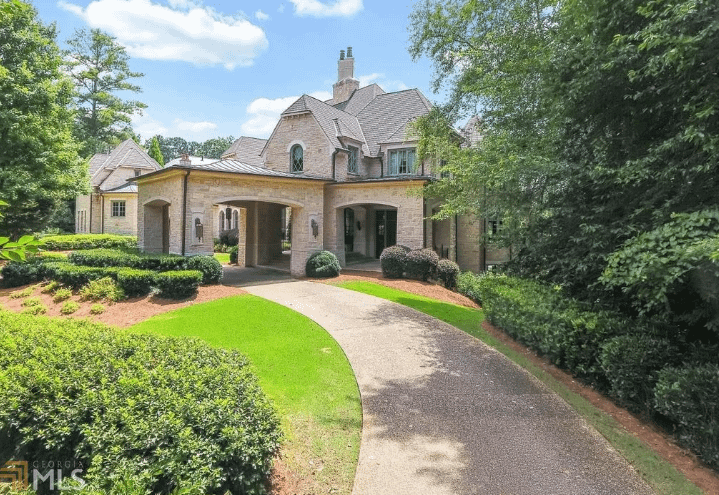 Lakefront Limestone Home In Suwanee, Georgia - Homes of the Rich
