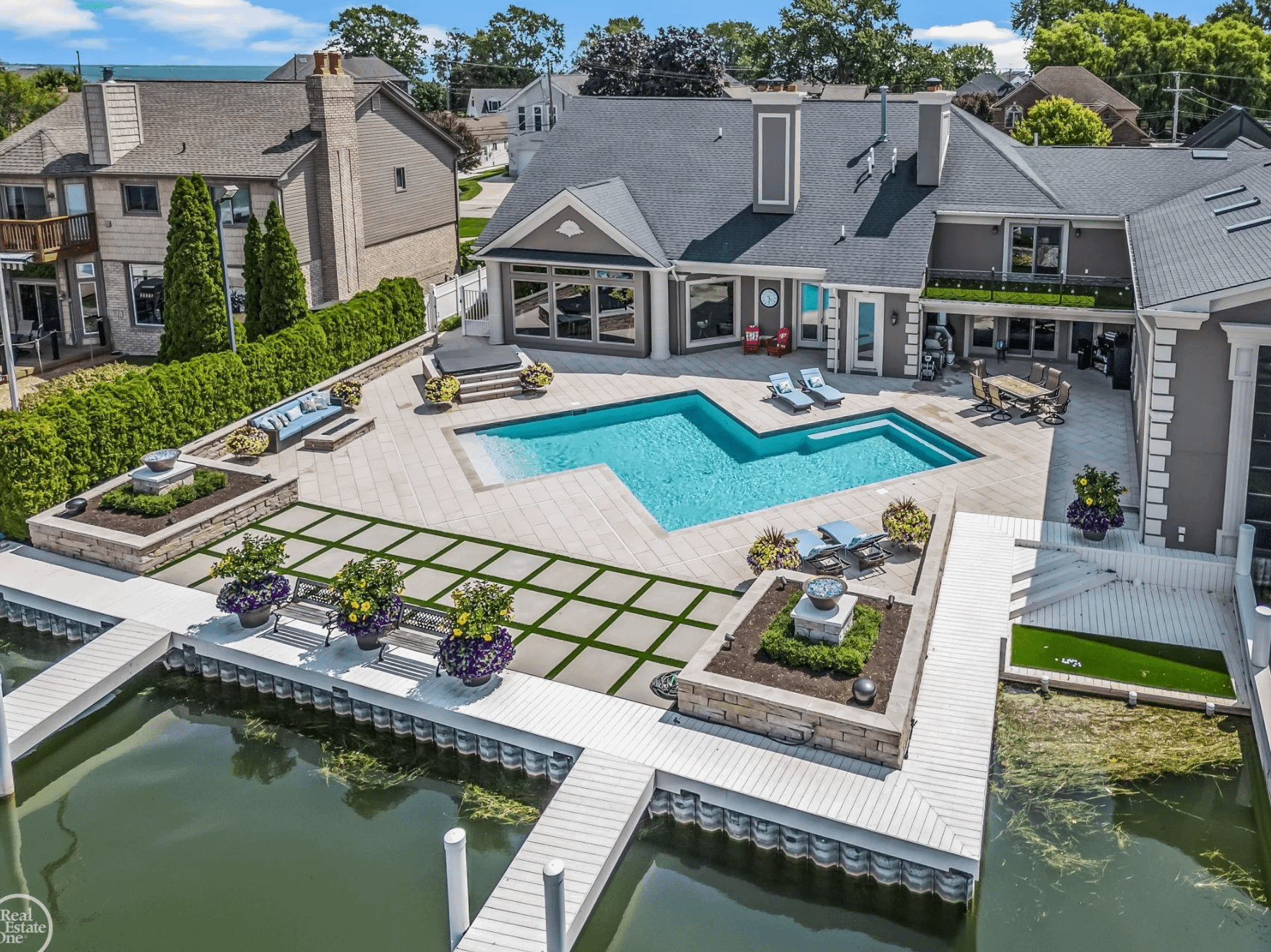 Michigan Waterfront Home Comes With An Attached Boathouse