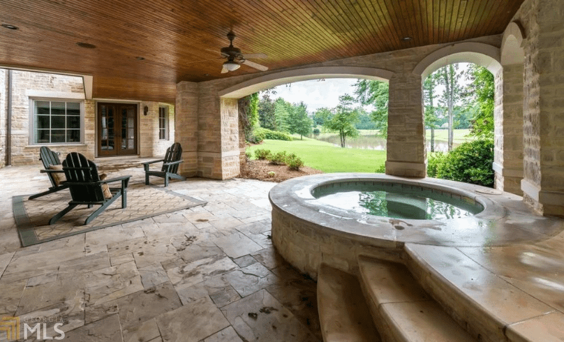 Lakefront Limestone Home In Suwanee, Georgia - Homes of the Rich